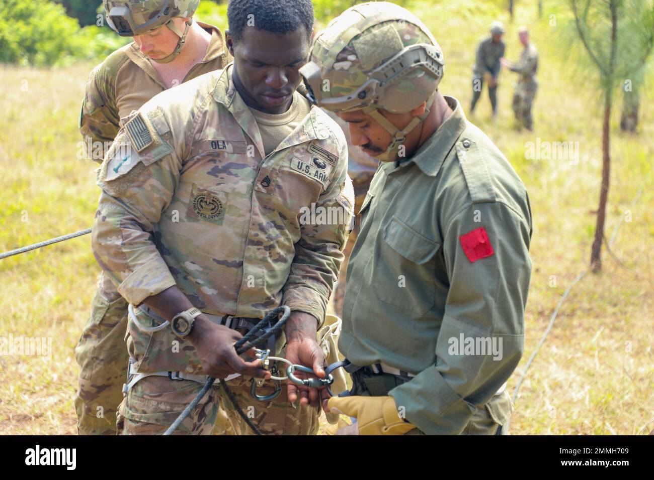 Staff Sgt. Daudi Ola, a rappel master assigned to B Company, 2nd ...