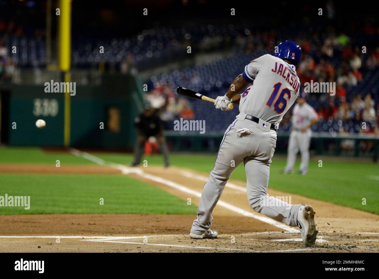 New York Mets' Austin Jackson follows through after hitting an RBI ...