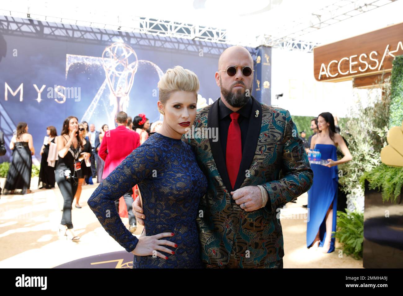 Rachel Reichard, left, and Chris Sullivan arrives at the 70th Primetime ...