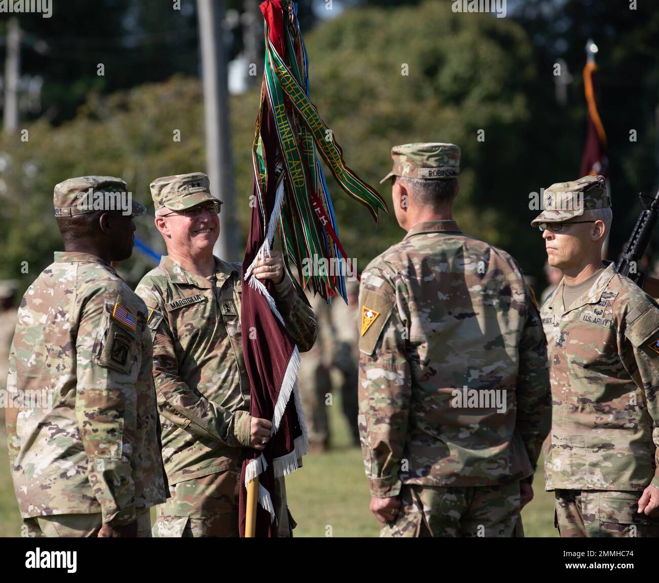 Maj. Gen. Joseph A. Marsiglia smiles as he receives the colors during a ...
