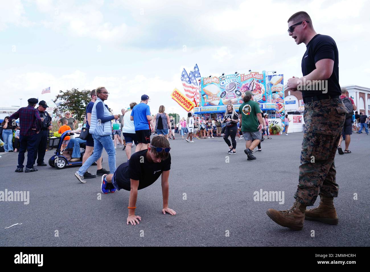 U.S. Marine Corps Sgt. Christian D. McCormickbello, right, a recruiter ...