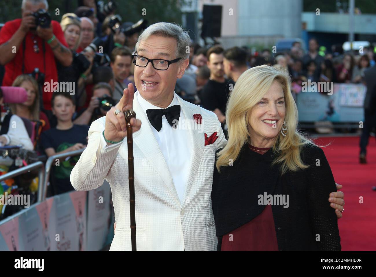 Director Paul Feig and wife Laurie Feig pose for photographers upon ...