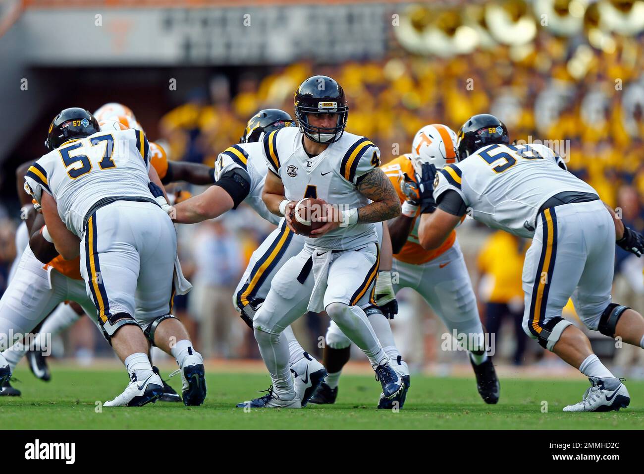East Tennessee State University quarterback Logan Marchi (4) hands the ...