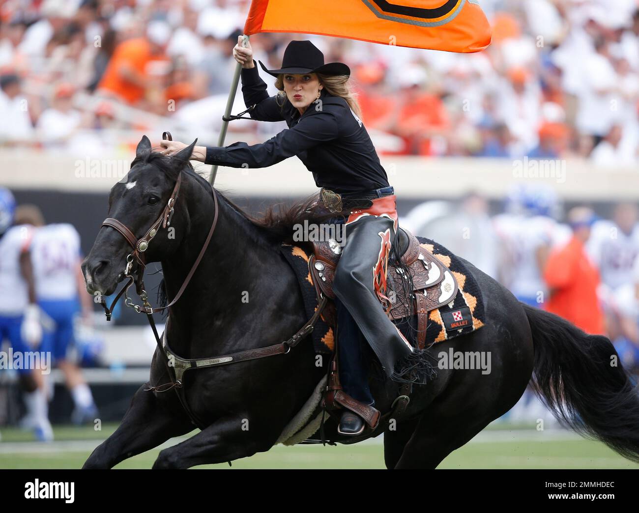 The Oklahoma State spirit rider and Bullet ride across the field ...