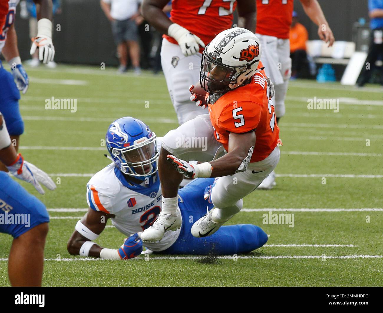Oklahoma State running back Justice Hill (5) is tackled by Boise State ...