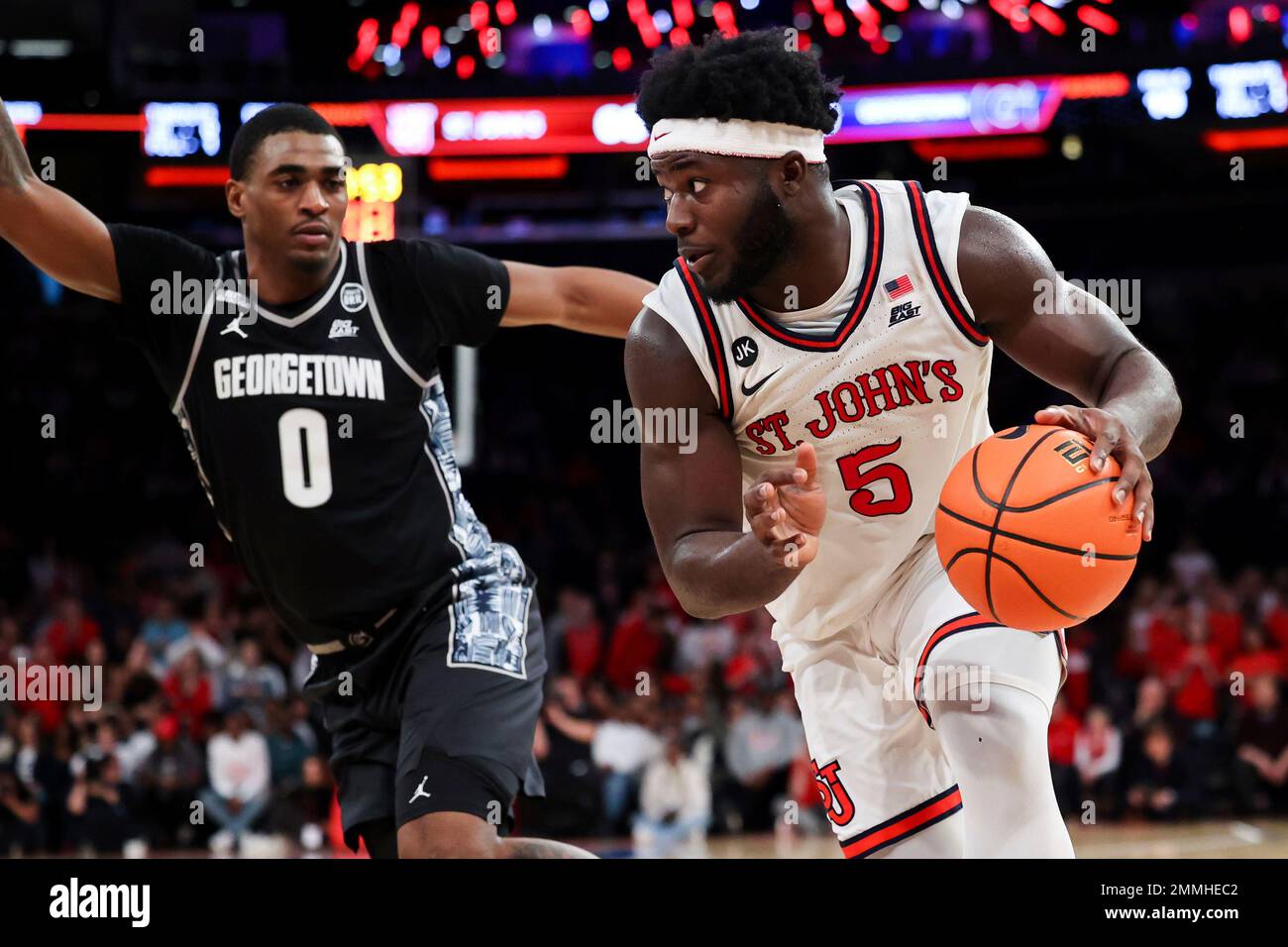 St. John's guard Dylan Addae-Wusu (5) dribbles against Georgetown guard ...