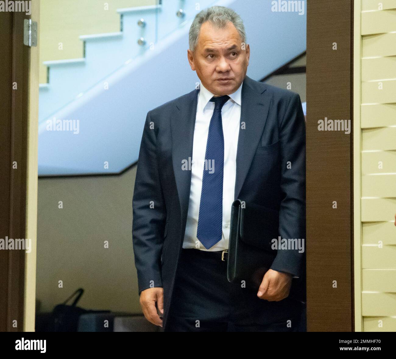 Russian Defense Minister Sergei Shoigu enters a hall as Turkish ...