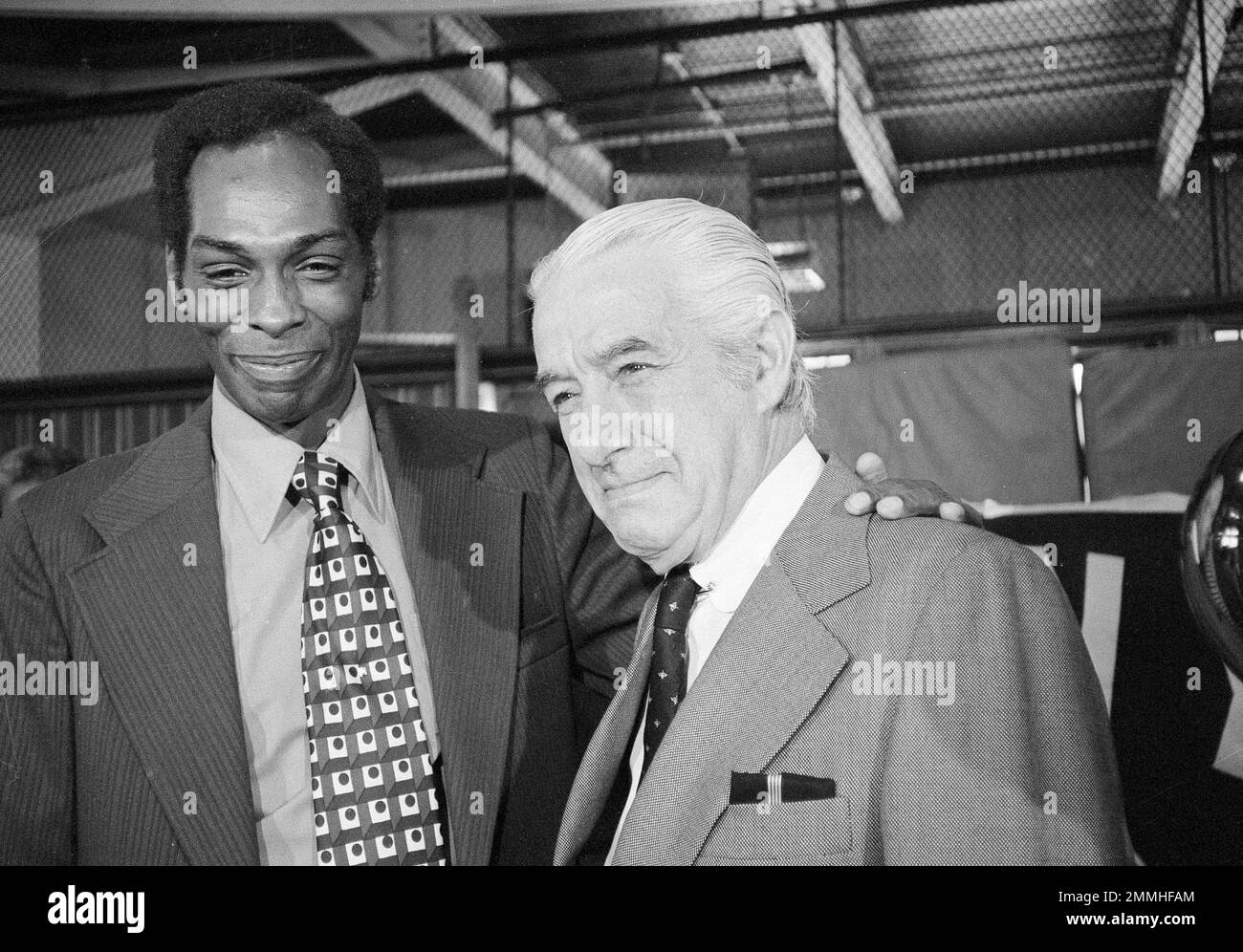 Famed basketball player and coach Nat Holman, right, stands with Floyd ...