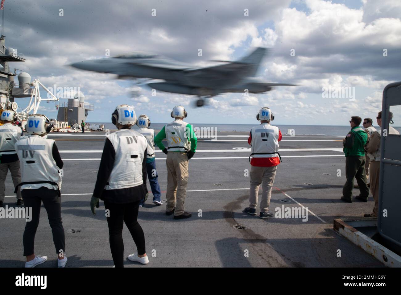 Capt. Jeremy Shamblee, center, the first-in class aircraft carrier USS ...