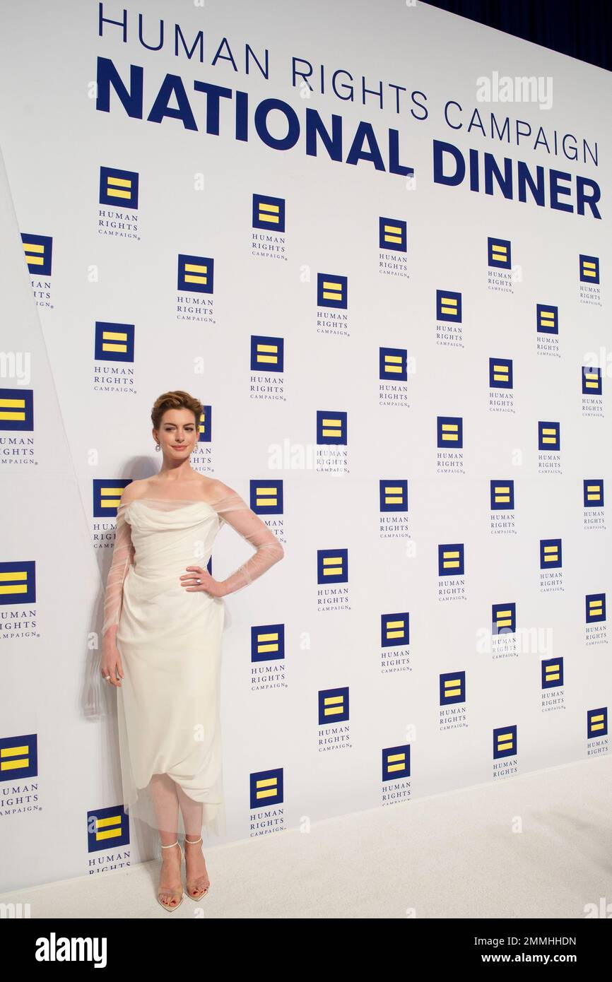 Actress Anne Hathaway poses for photographers as she arrives at the ...