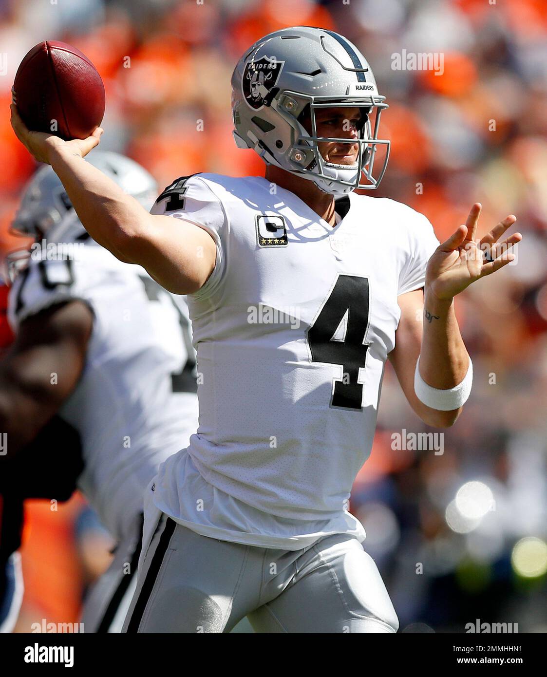Oakland Raiders quarterback Derek Carr (4) throws against the Denver ...