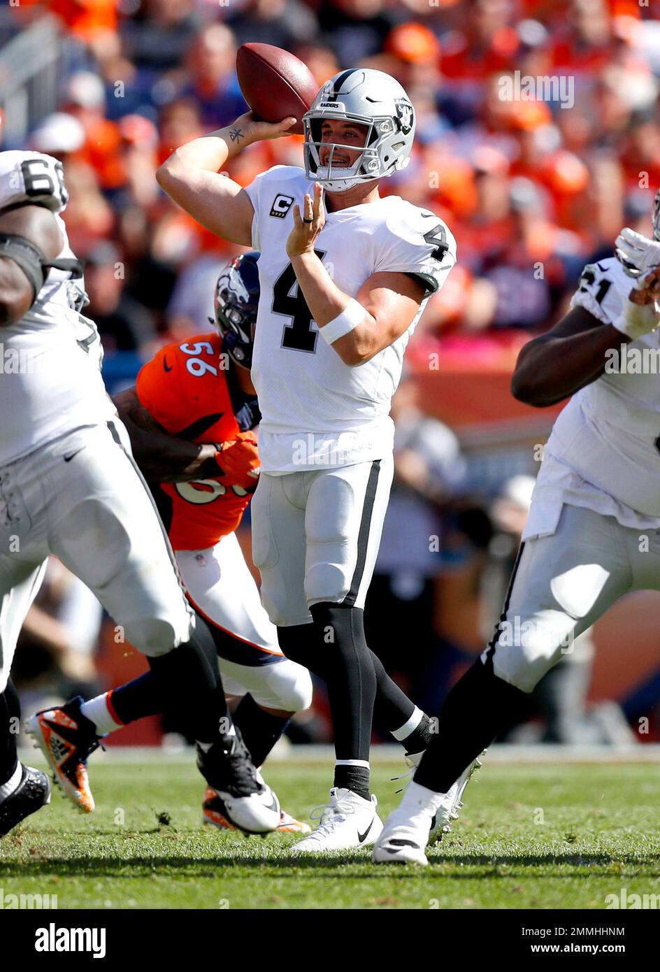 Oakland Raiders quarterback Derek Carr (4) throws against the Denver ...