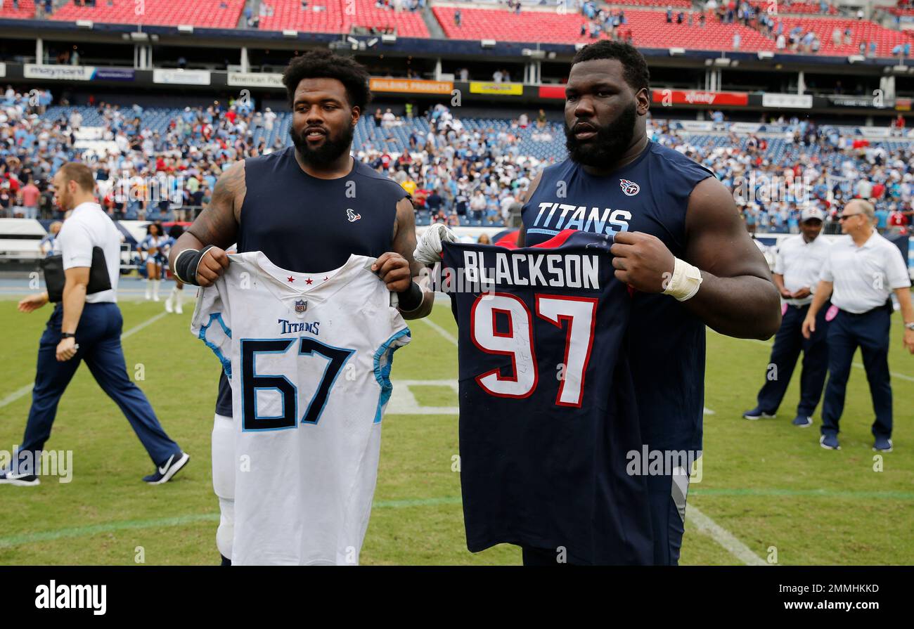 Houston Texans defensive end Angelo Blackson, left, and Tennessee ...