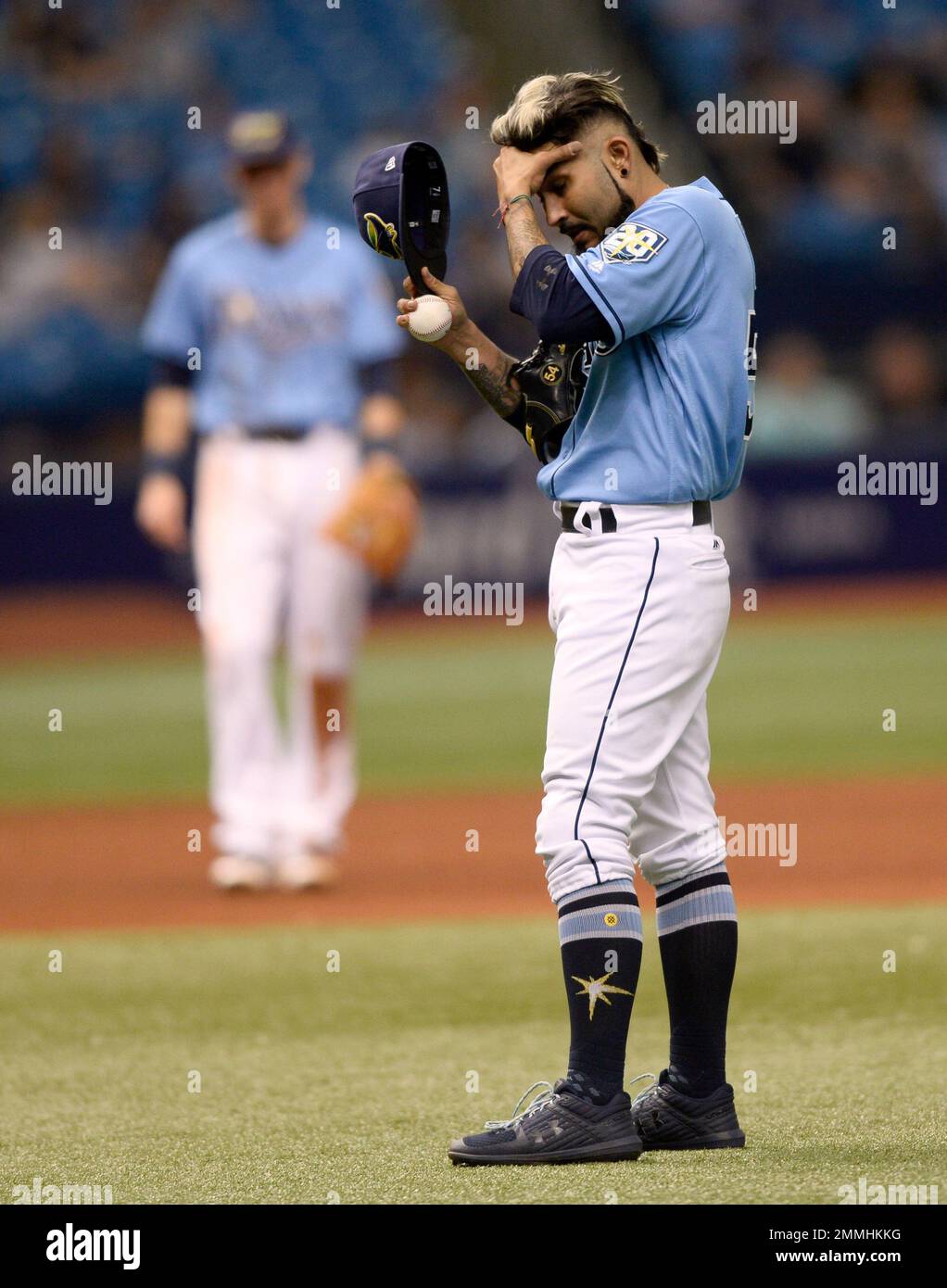Tampa Bay Rays pitcher Sergio Romo, right, reacts after giving up a ...