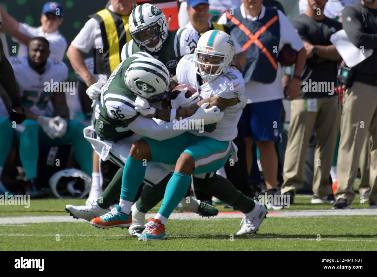 New York Jets' Doug Middleton (36) tackles Miami Dolphins' Albert ...