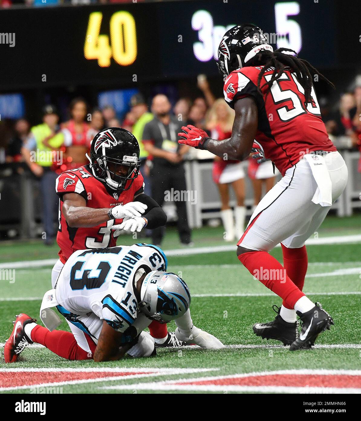 Carolina Panthers wide receiver Jarius Wright (13) falls into the end ...