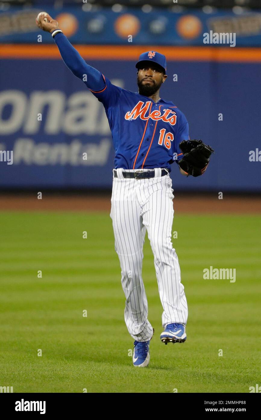 New York Mets' Austin Jackson (16) throws a ball to fans during the ...