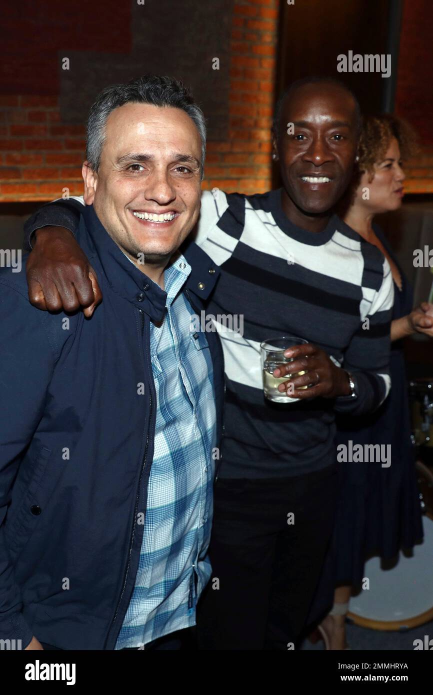 Director Joe Russo, left, and Don Cheadle pose for a photo at the star ...