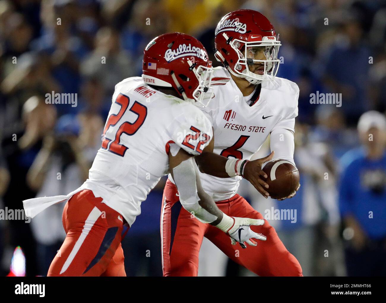 Fresno State quarterback Marcus McMaryion, right, hands off to running ...