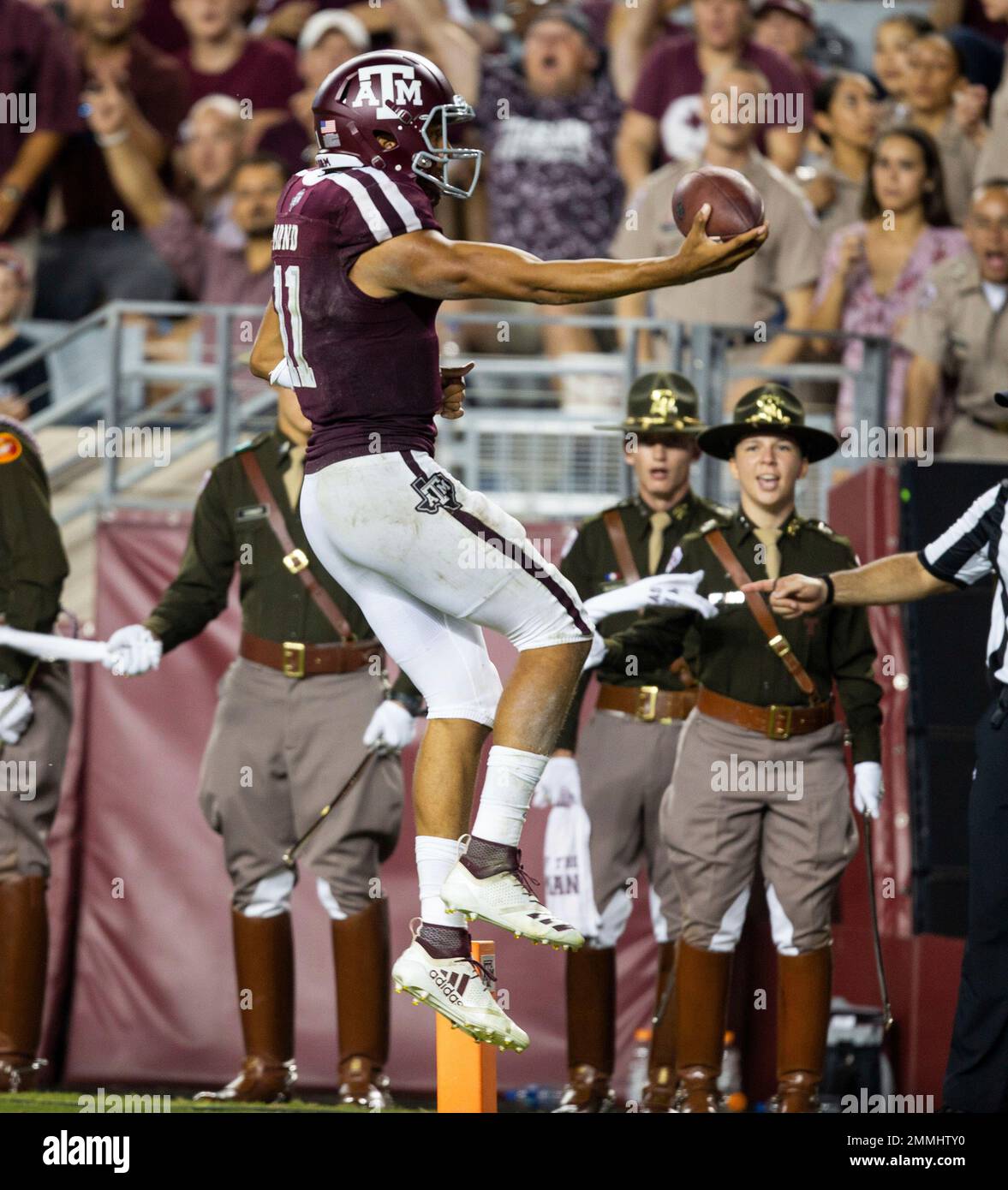 Texas A&M quarterback Kellen Mond (11) hops over the goal line for a ...