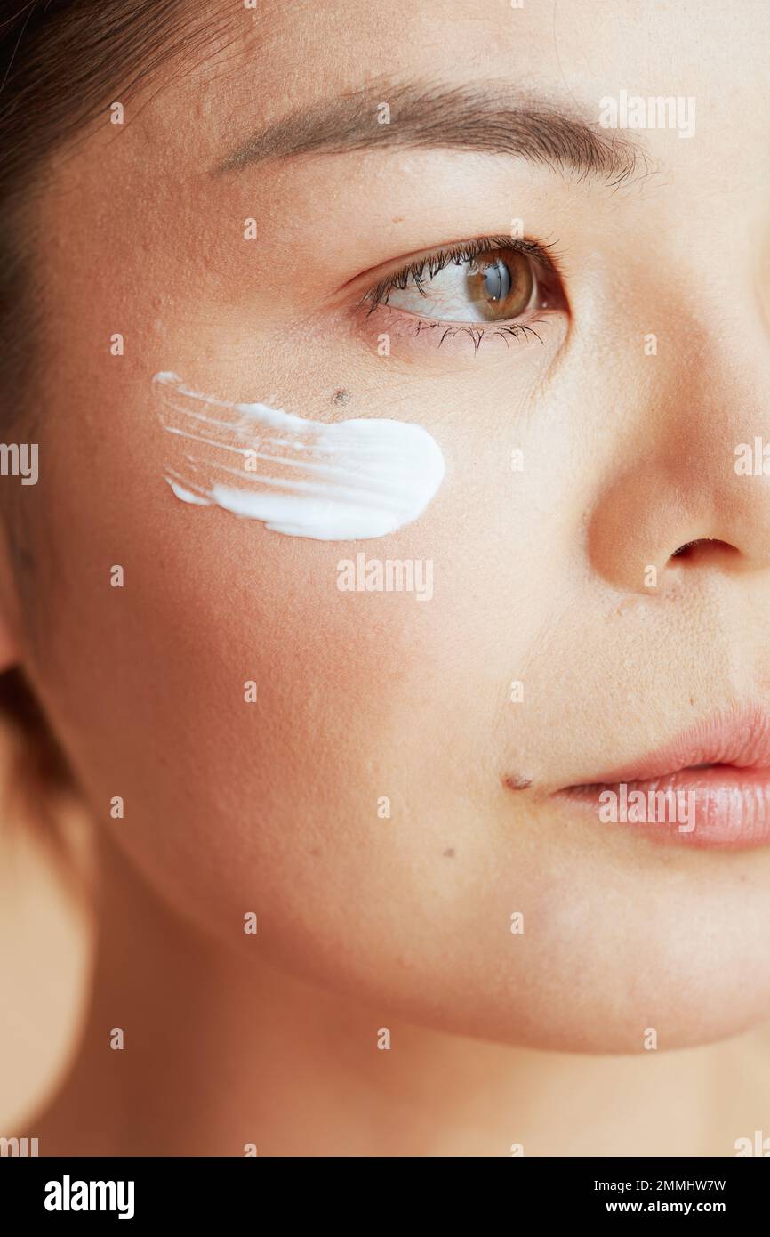 Woman applying lotion wrinkle face hi-res stock photography and images ...