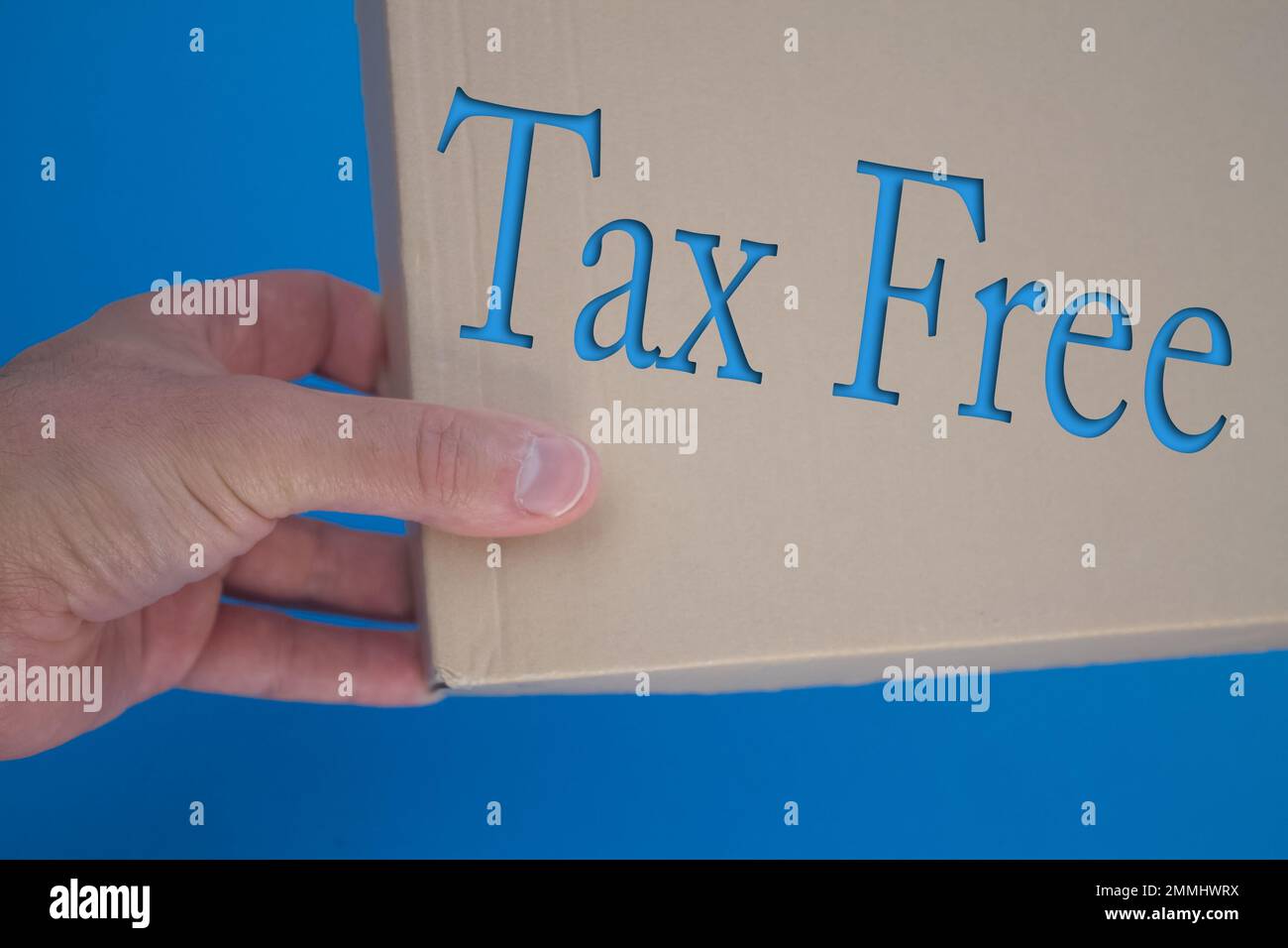 Tax Free word with cardboard box. Brown folded card box Stock Photo - Alamy
