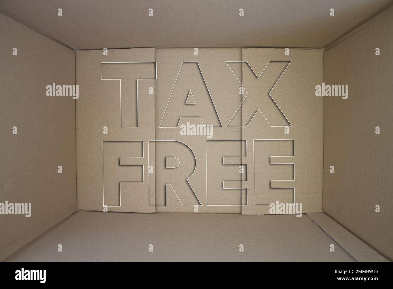 Tax Free word with cardboard box. Brown folded card box Stock Photo - Alamy
