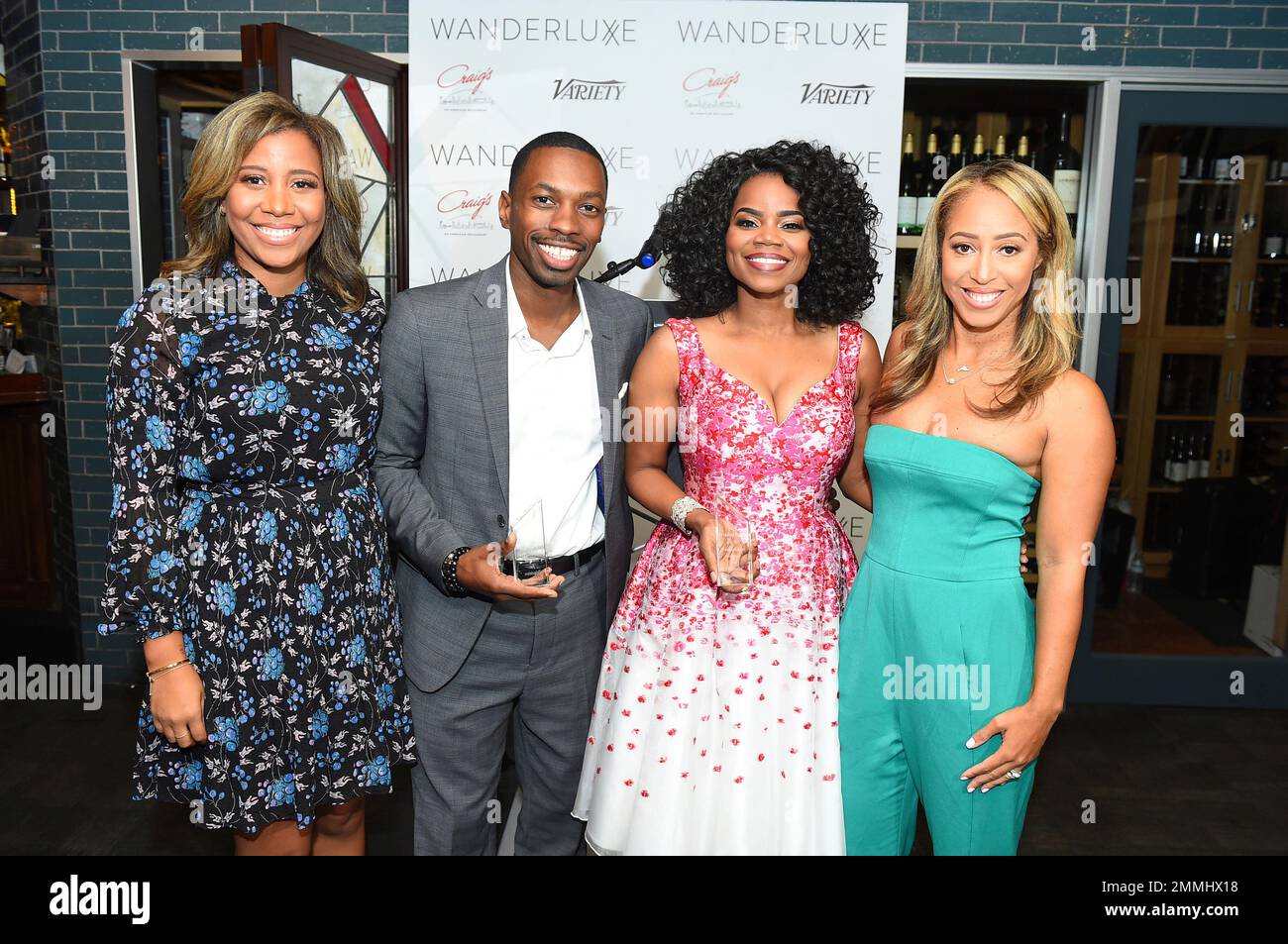 Marti Hines, 2018 honorees Melvin Jackson Jr. and Kelly Jenrette, and ...