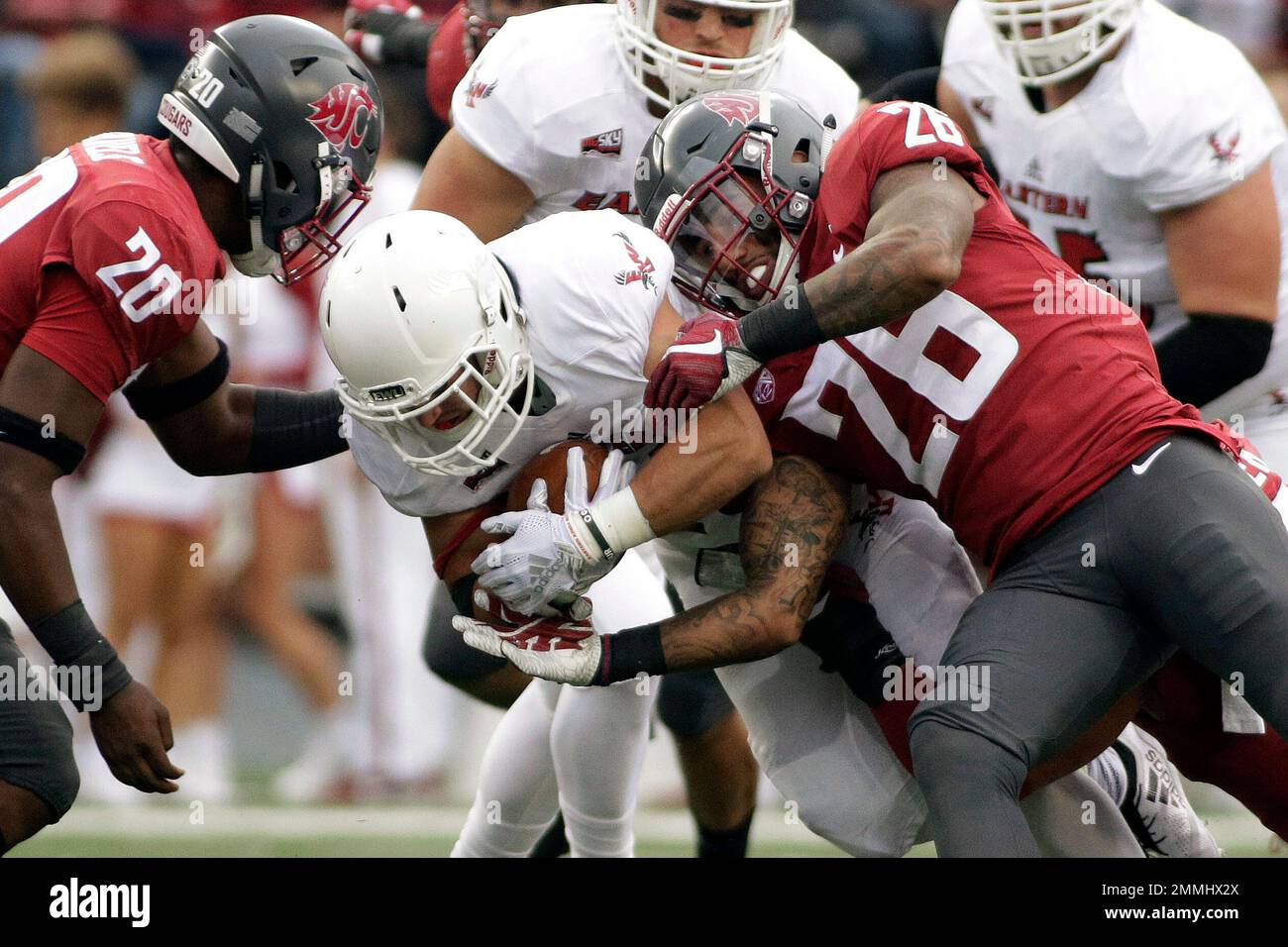 Washington State defensive back Hunter Dale (26) tackles Eastern Washington running back Sam ...