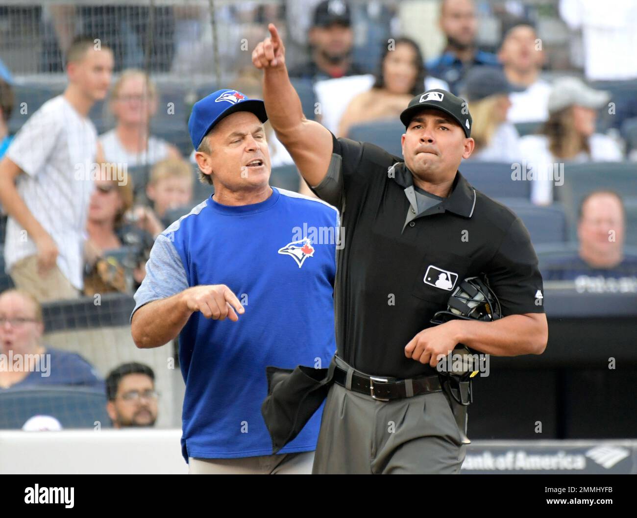 Umpire Roberto Ortiz (40) throws Toronto Blue Jays manager John Gibbons out of the baseball game ...