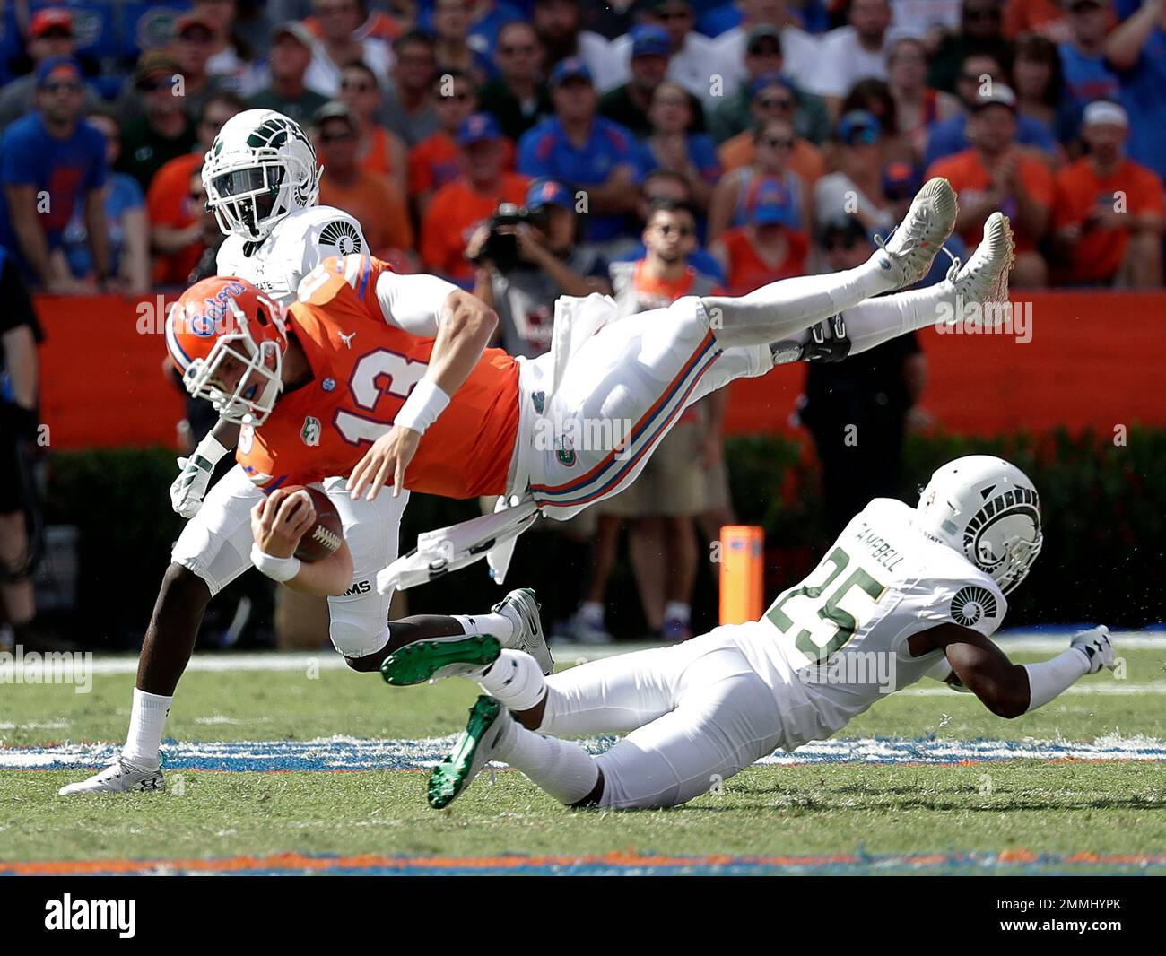 Florida quarterback Feleipe Franks (13) is upended by Colorado State ...