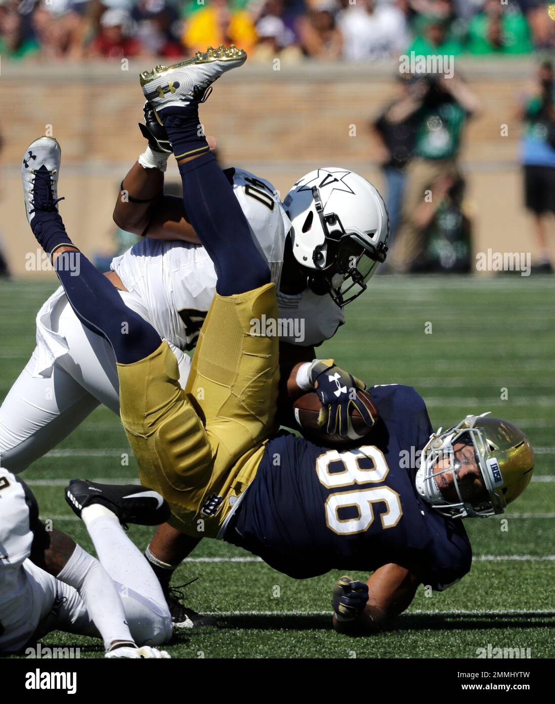 Notre Dame tight end Alize Mack, right, is tackled by Vanderbilt ...