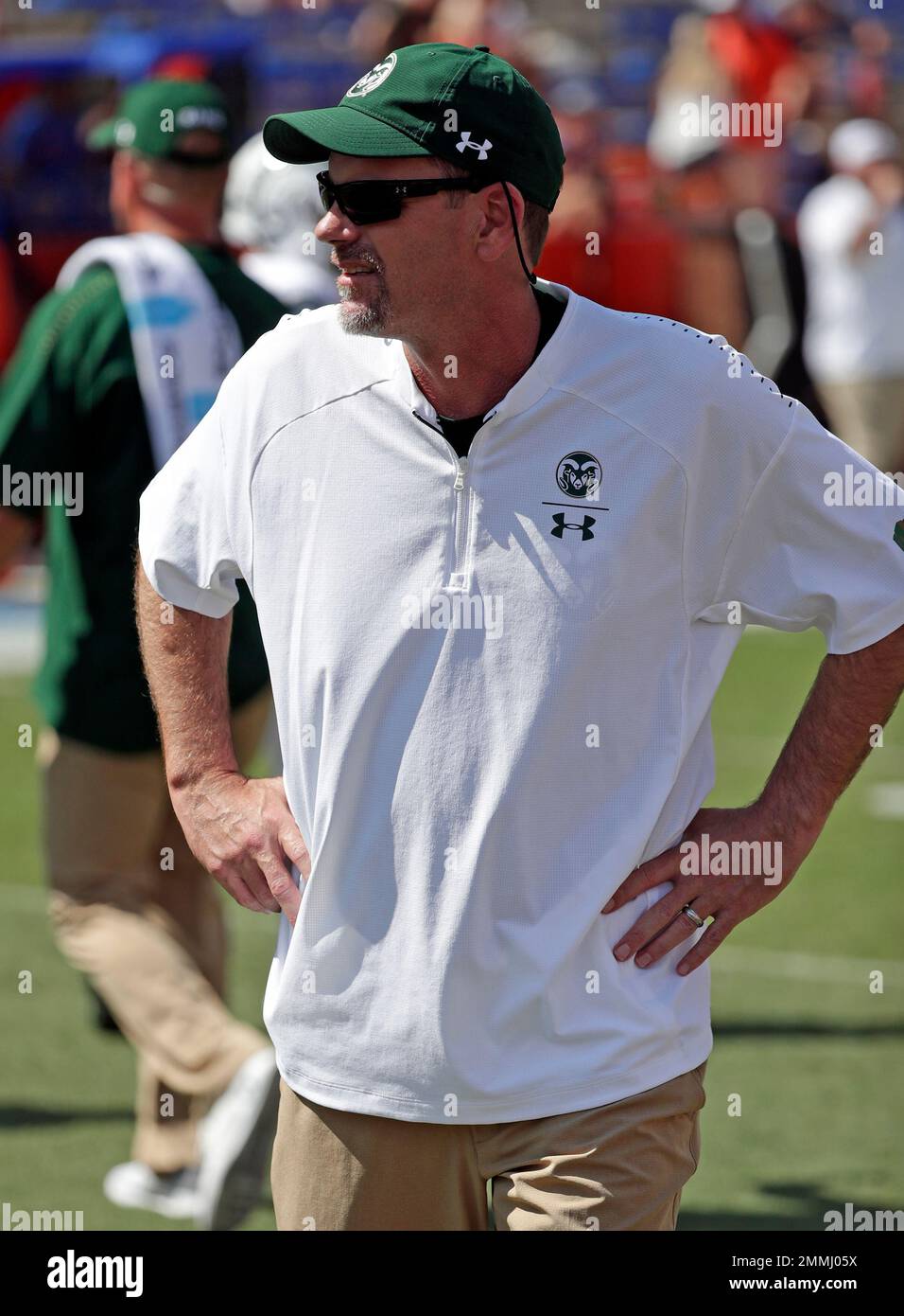 Colorado State head coach Mike Bobo watches his team warm up before an ...
