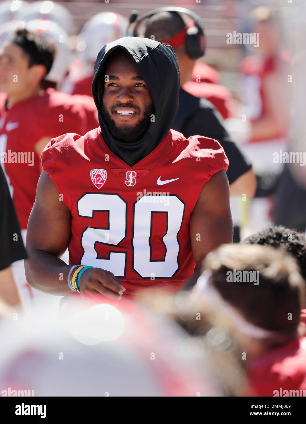 Stanford running back Bryce Love (20) hangs out on the sidelines with ...