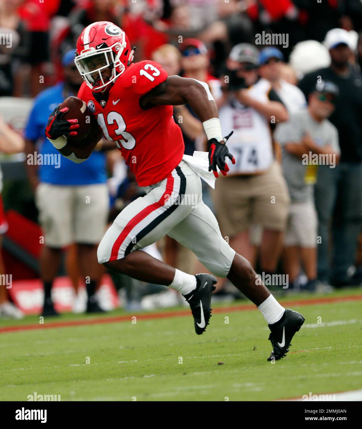 Georgia running back Elijah Holyfield (13) runs for a big gain in the ...