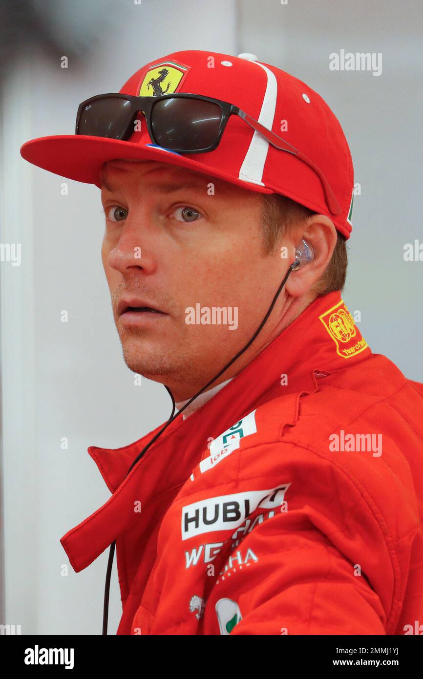 Ferrari driver Kimi Raikkonen of Finland getting ready in his team ...