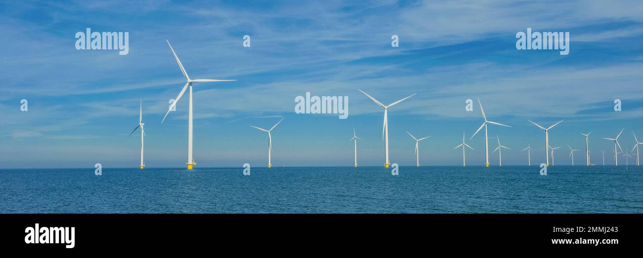 Drone view at wind mill turbines, Windmill park with clouds and a blue ...