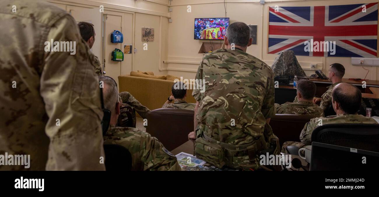 Members of the coalition watch the funeral service for Queen Elizabeth ...