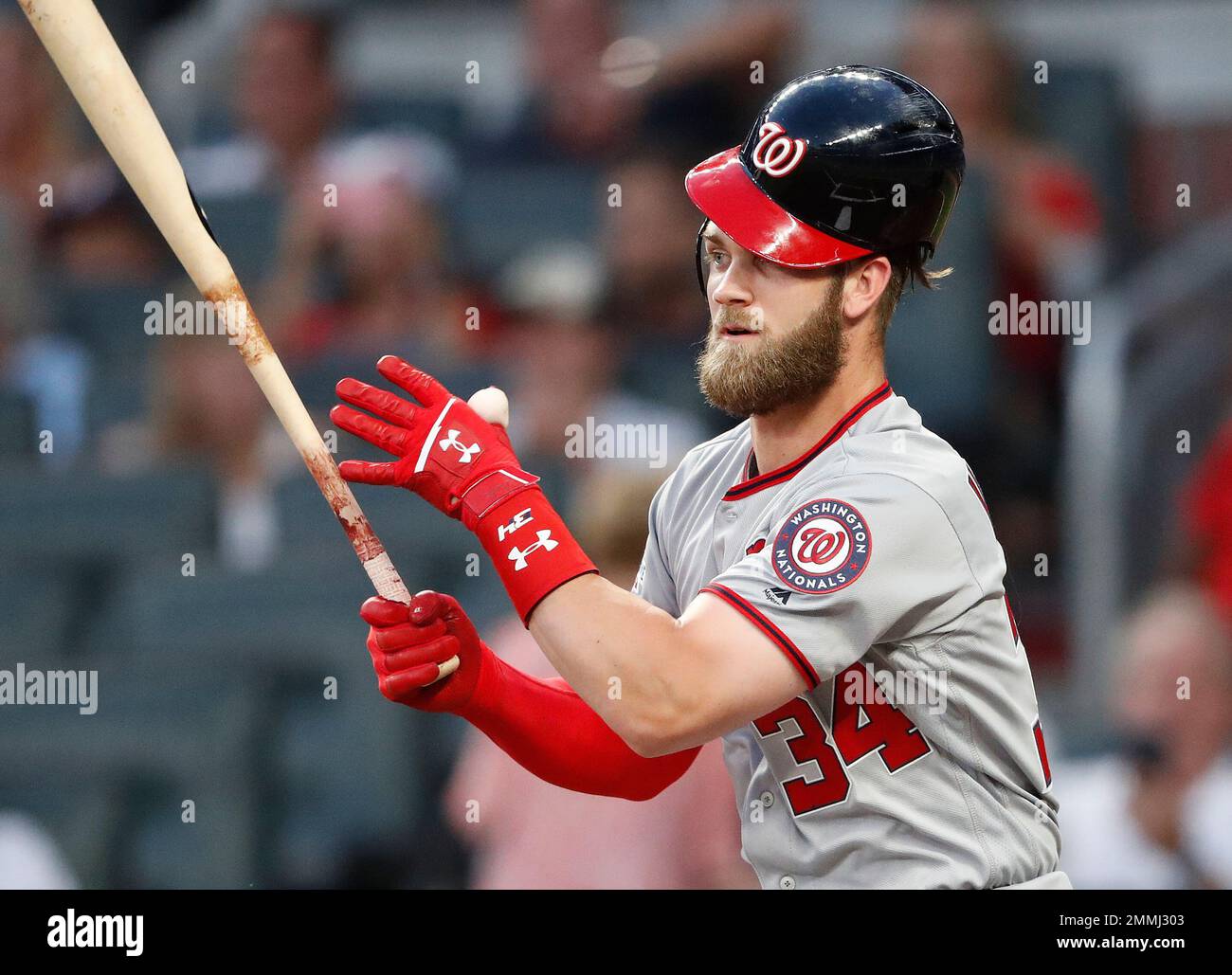 Washington Nationals right fielder Bryce Harper (34) follows through on ...