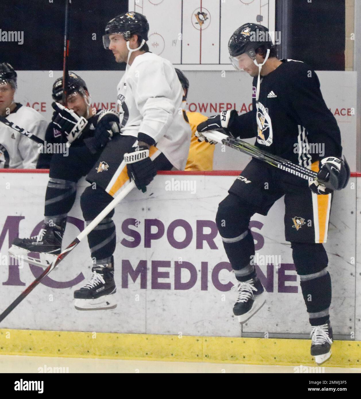 Pittsburgh Penguins' Kris Letang, left and Matt Cullen, right, take to ...