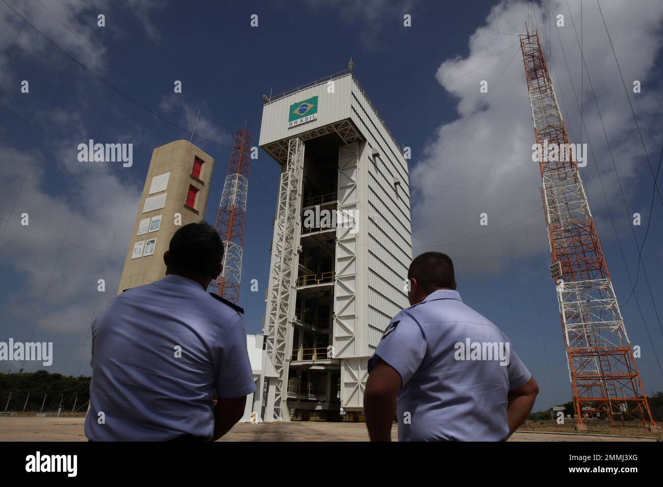 Airmen of the Brazilian Air Force observe the launch tower of the ...
