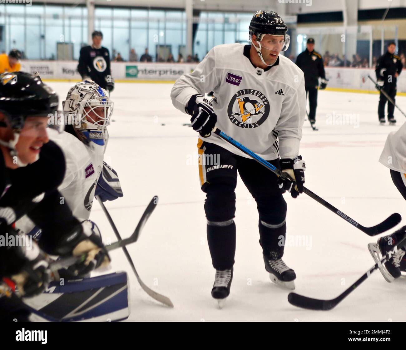 Pittsburgh Penguins defenseman Jack Johnson, right, stands in the ...