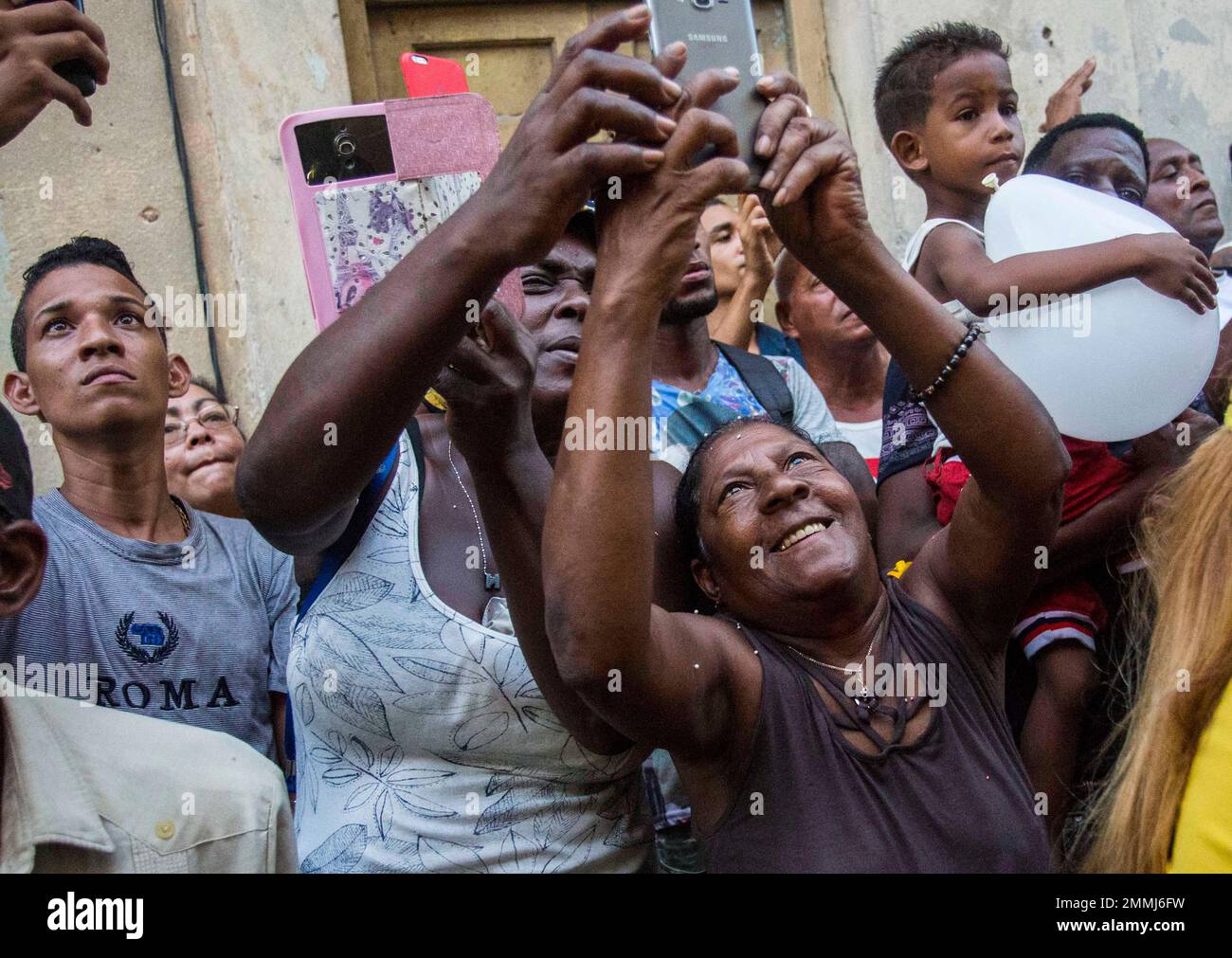 In this Sept. 8, 2018 photo, people take pictures of the annual Virgin ...