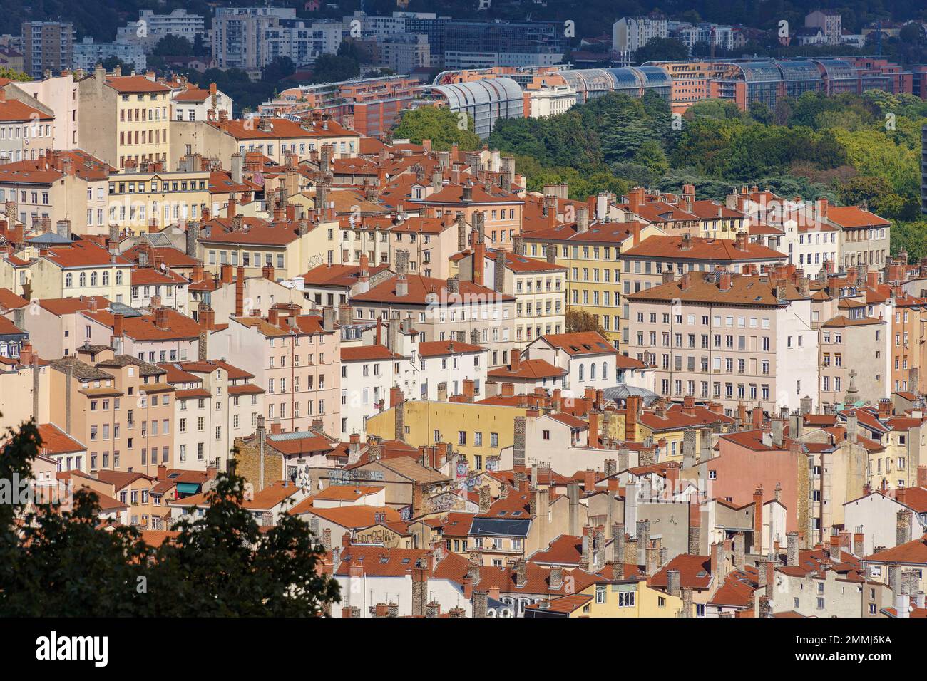 Tangled web of older buildings and chimneys gradually give way to more ...