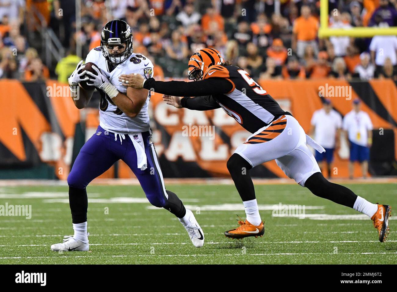 Baltimore Ravens tight end Mark Andrews (89) is pursued by Cincinnati ...