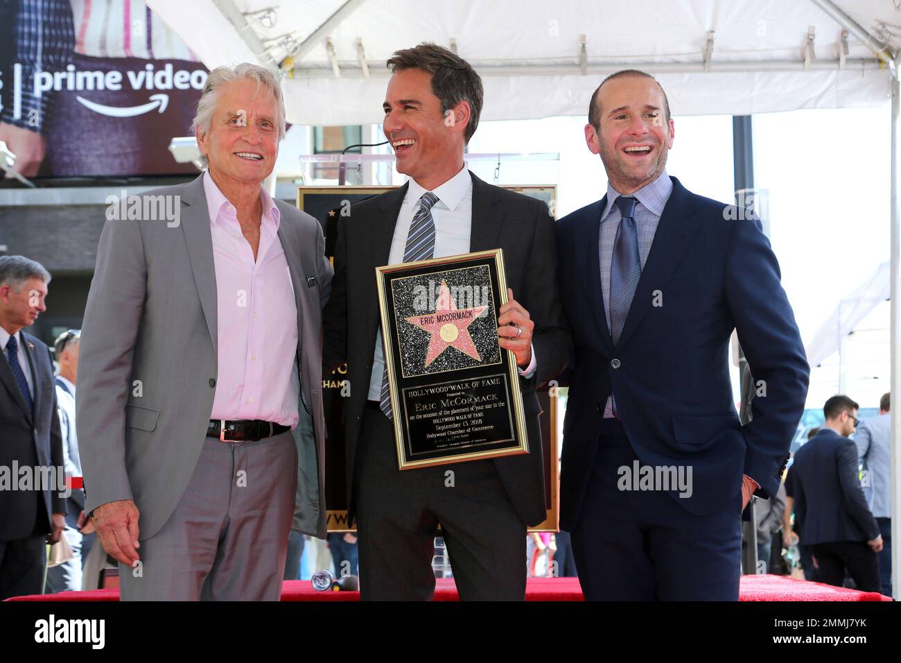 Michael Douglas, from left, Eric McCormack and Max Mutchnick smile as ...