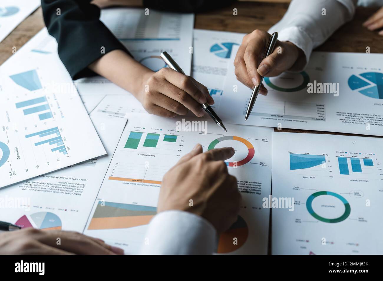 Economic business discussions, Business team analyzing income charts ...