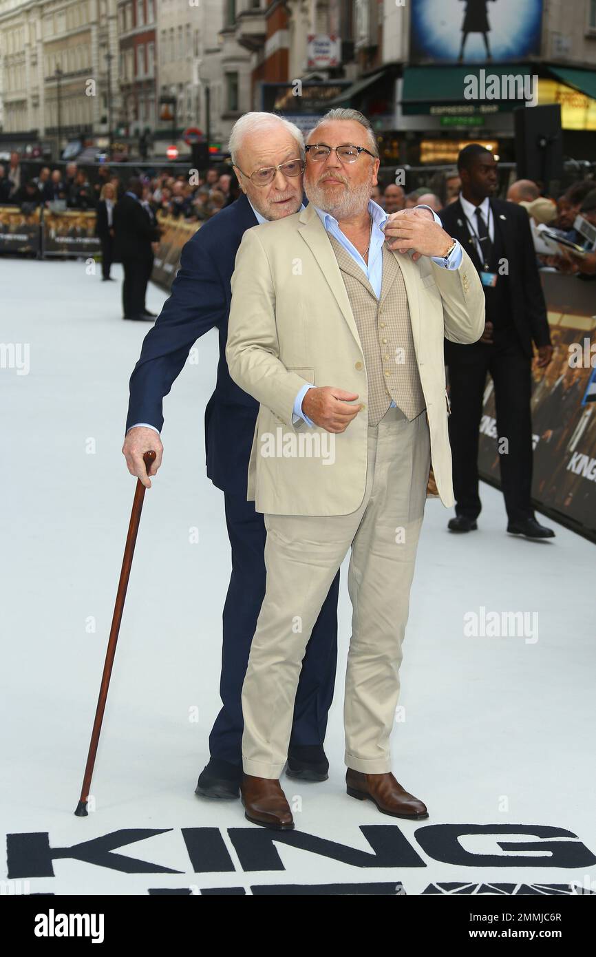 Sir Michael Caine hugs Ray Winstone poses for photographers upon ...