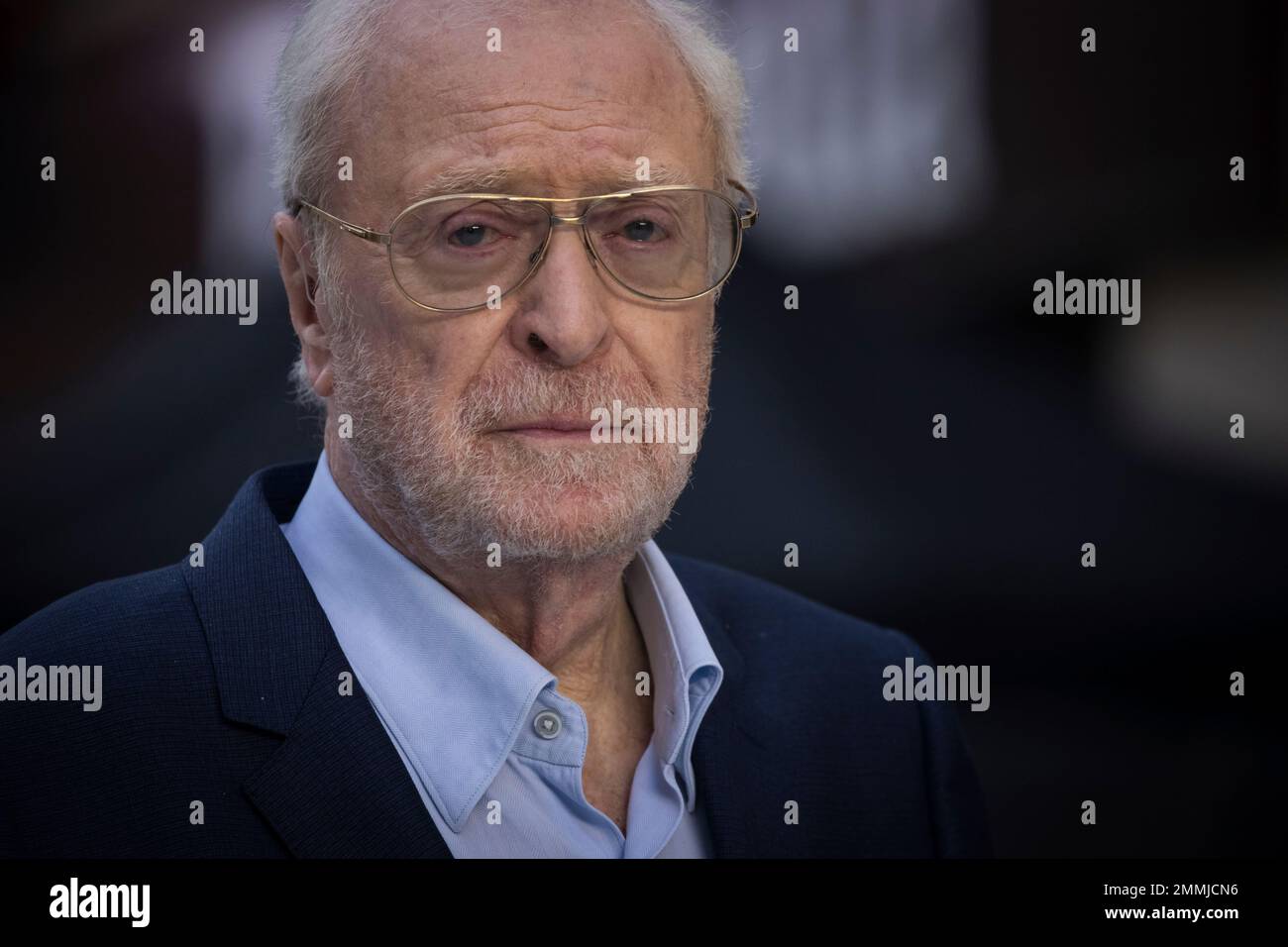 Actor Michael Caine poses for photographers upon arrival at the world ...
