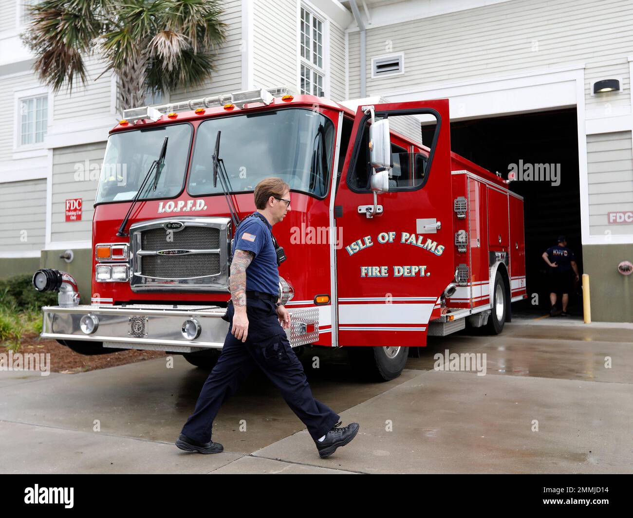 Victor Lawrence, with the Isle of Palms fire department, prepares to ...
